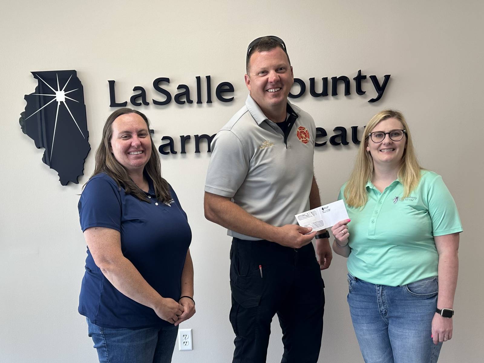 Farm Bureau donates $1K to Ottawa Fire Department for rescue equipment ...