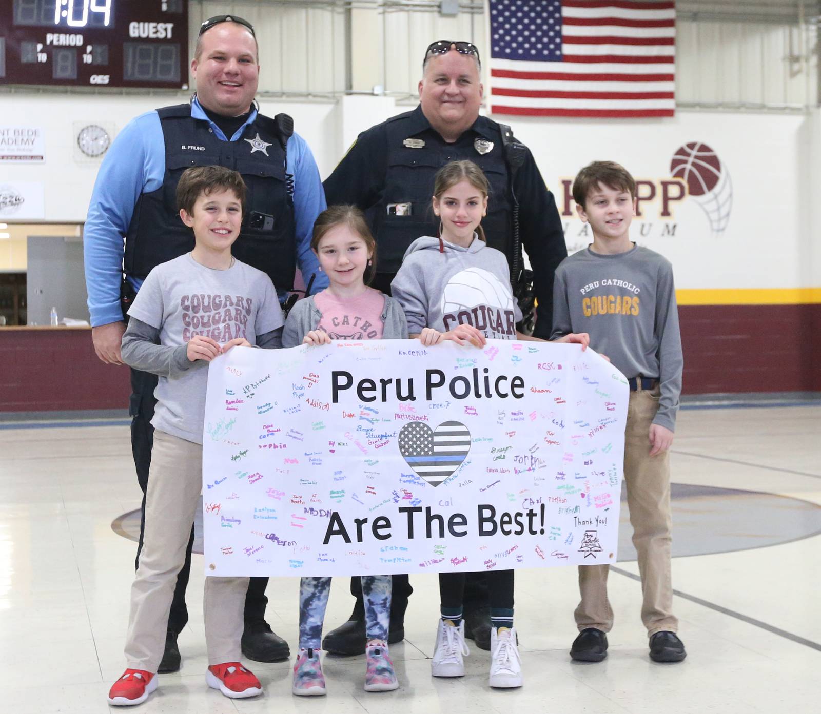 Photos: Peru Catholic honors Peru police, fire during Catholic Schools ...