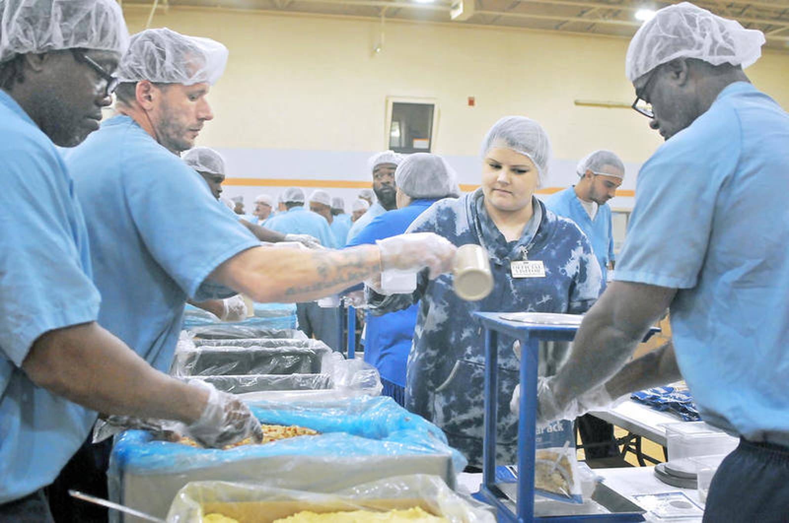 PHOTOS: Sheridan Correctional Center inmates pack meals for the hungry ...