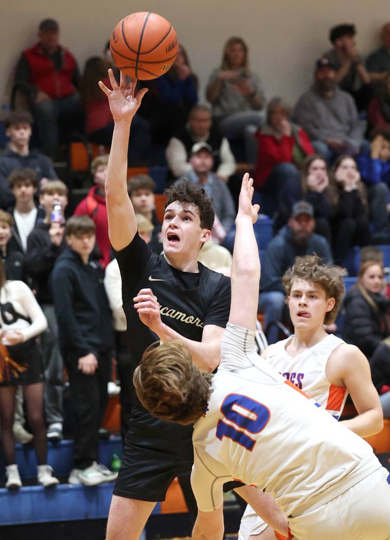Photos: Sycamore boys basketball travels to Genoa to take on the Cogs ...