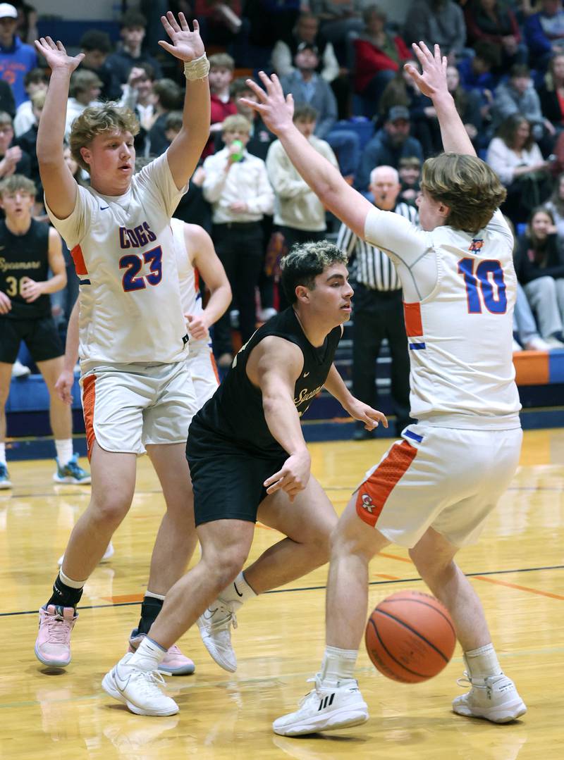 Photos: Sycamore boys basketball travels to Genoa to take on the Cogs ...