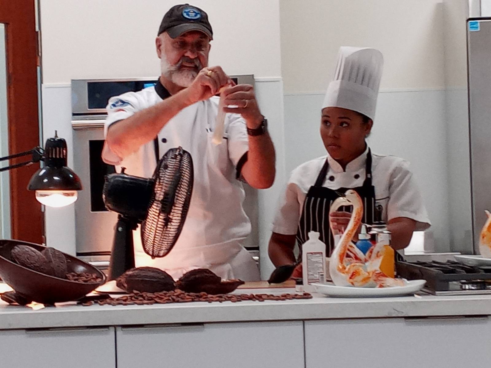 Owner of All Chocolate Kitchen demonstrates sugar sculpture as Geneva ...