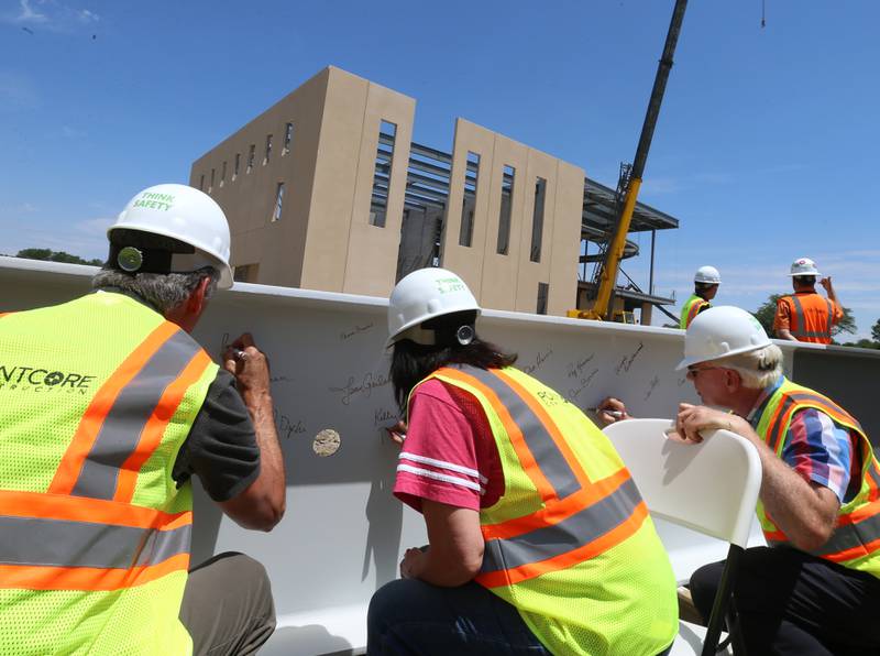 Photos: Beam signing, raising ceremony at the new YMCA site in Ottawa ...