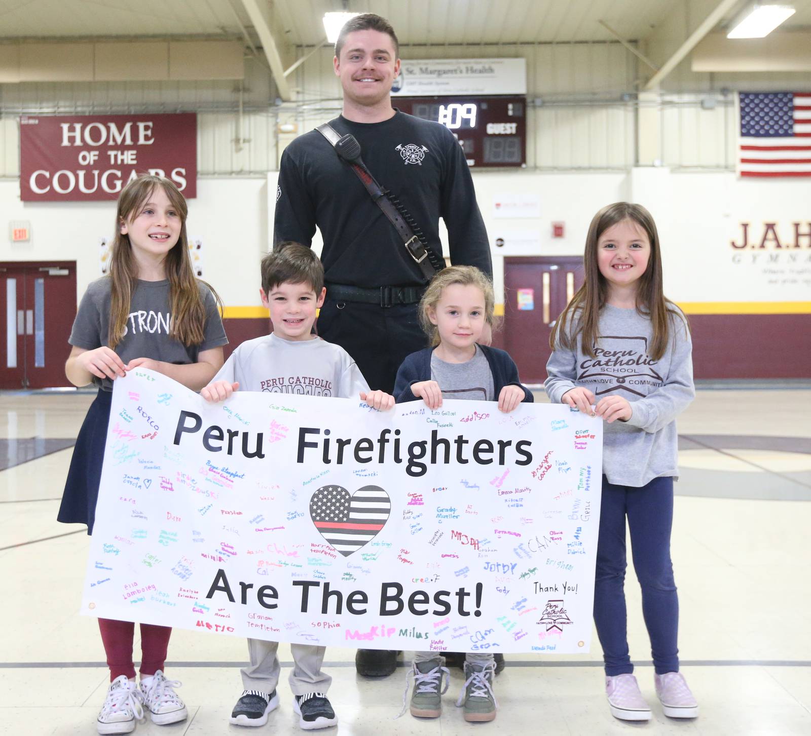 Photos: Peru Catholic honors Peru police, fire during Catholic Schools ...