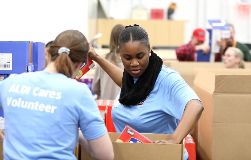 Photos: ALDI employees create disaster relief boxes at Northern ...