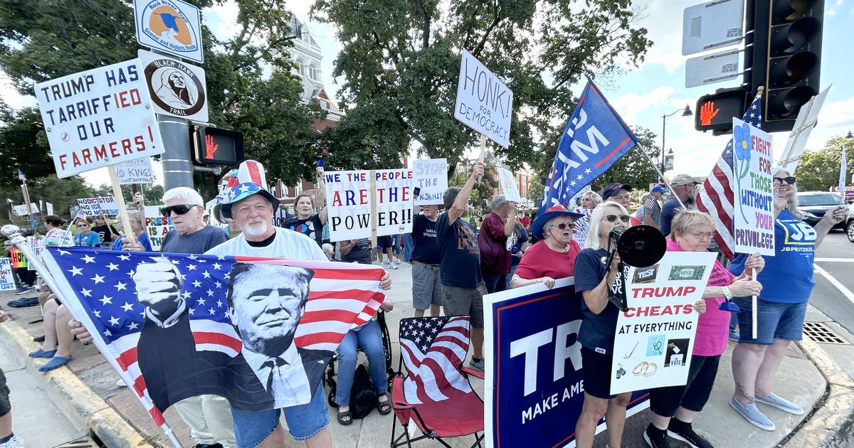 Anti- and pro-Trump signs displayed during ‘Workers Over Billionaires ...